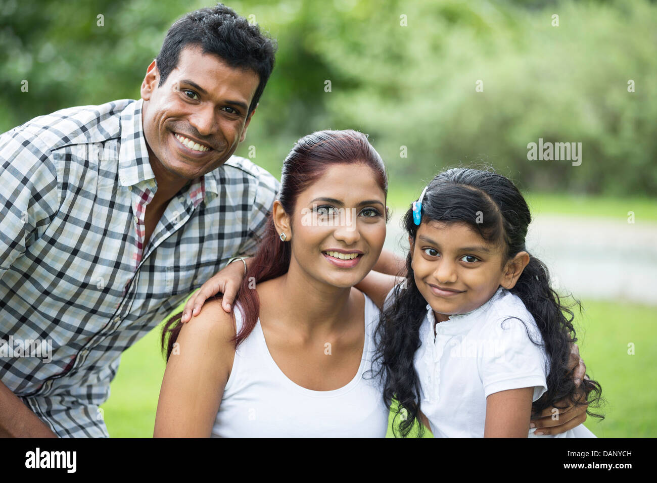 Happy Indian family. Father, mother and daughter in the park Stock ...