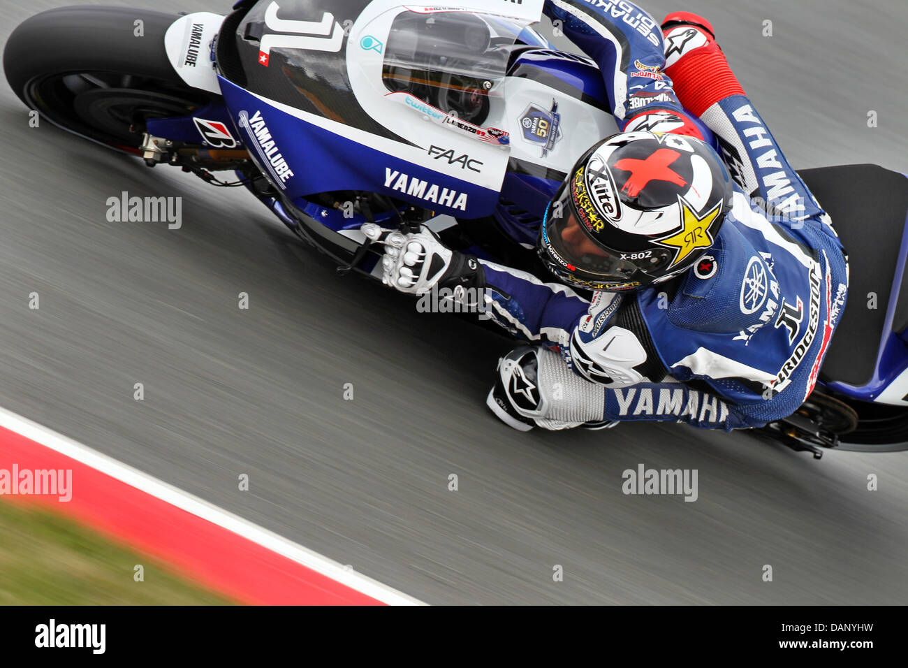 Spanish Yamaha pilot Jorge Lorenzo steers his motorcycle along a curve ...