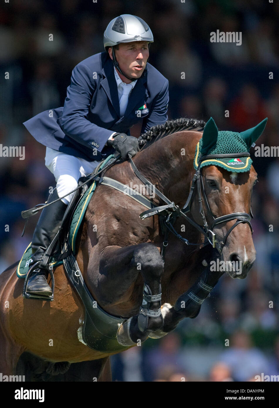 German equestrian Hans-Dieter Dreher jumps with his horse Magnus Romeo ...