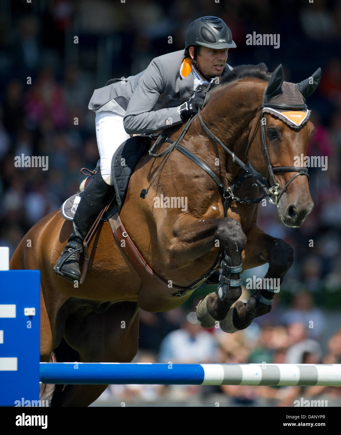 German equestrian Marco Kutscher jumps with his horse Cash during the ...