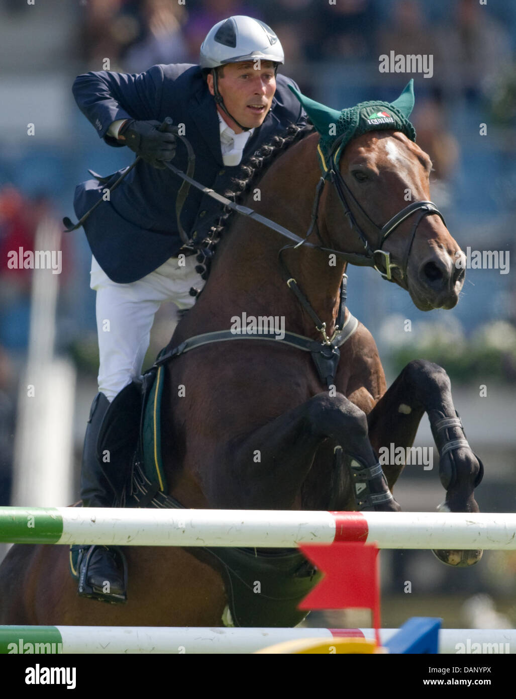 German equestrian Hans-Dieter Dreher jumps with his horse Magnus Romeo ...