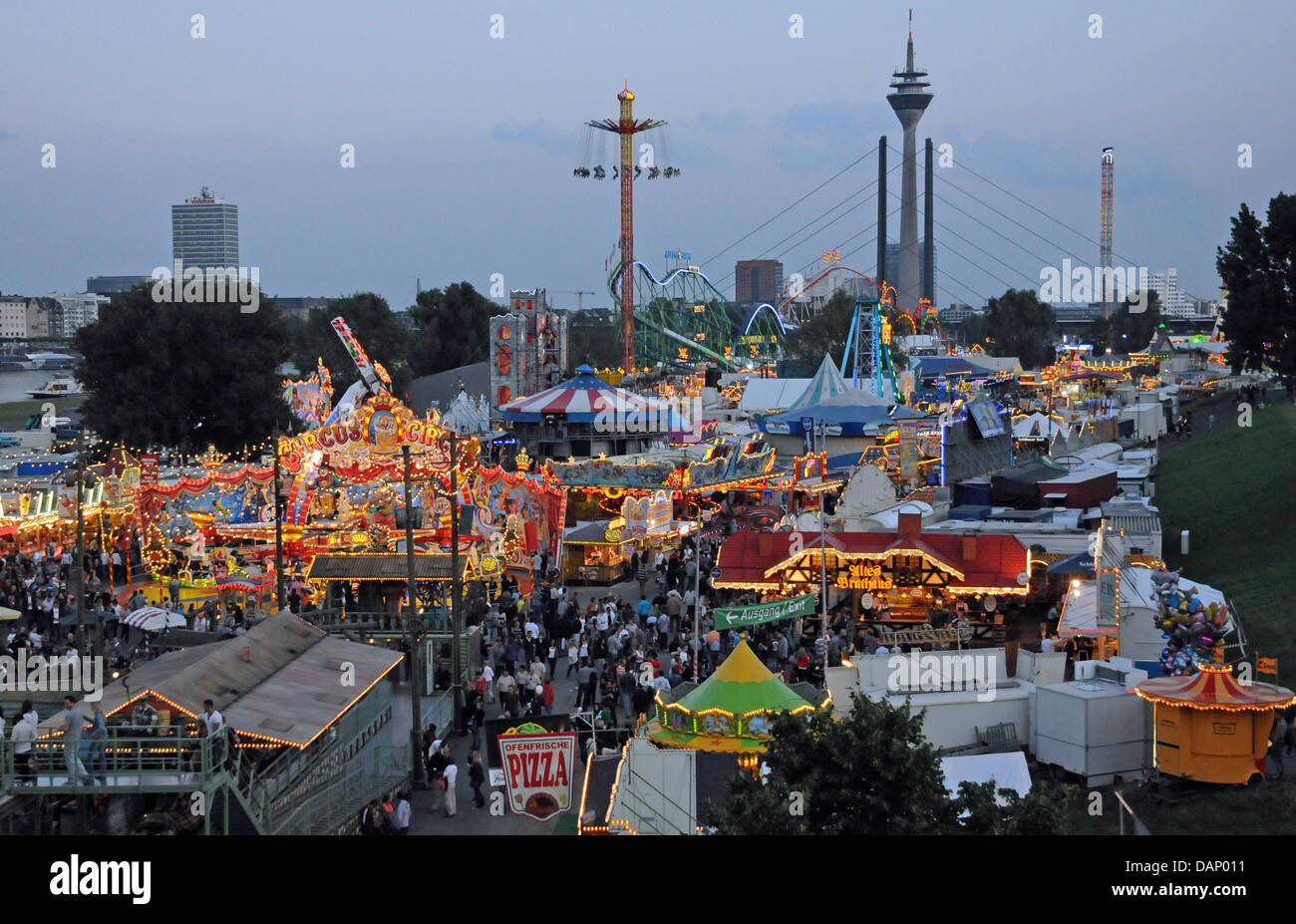 The fairgrounds are crowded at the Rhine funfair in Duesseldorf ...