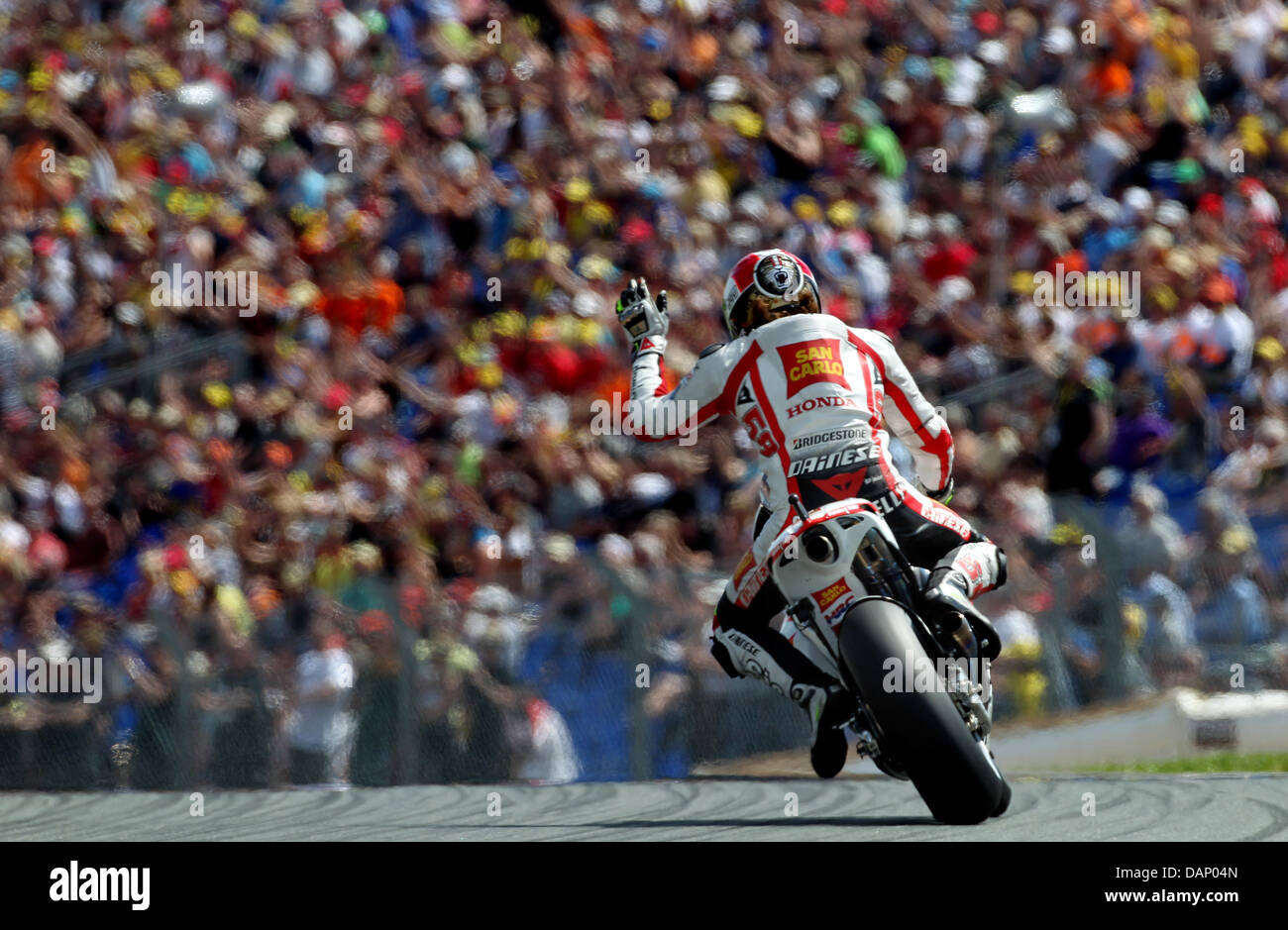 The Italian Honda driver Marco Simoncelli drives his motorcycle in the ...
