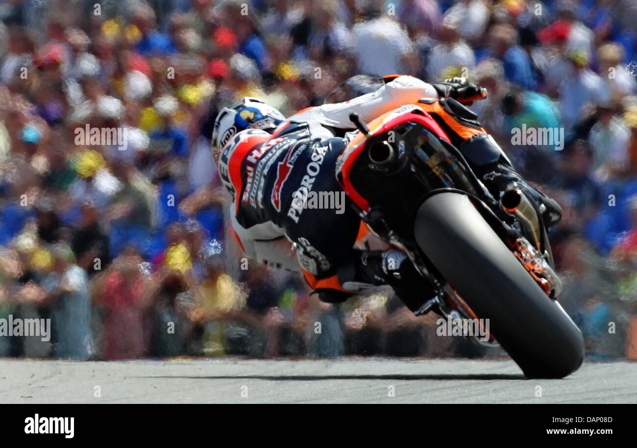 The Spanish Honda driver Daniel Pedrosa drives his motorcycle in the ...