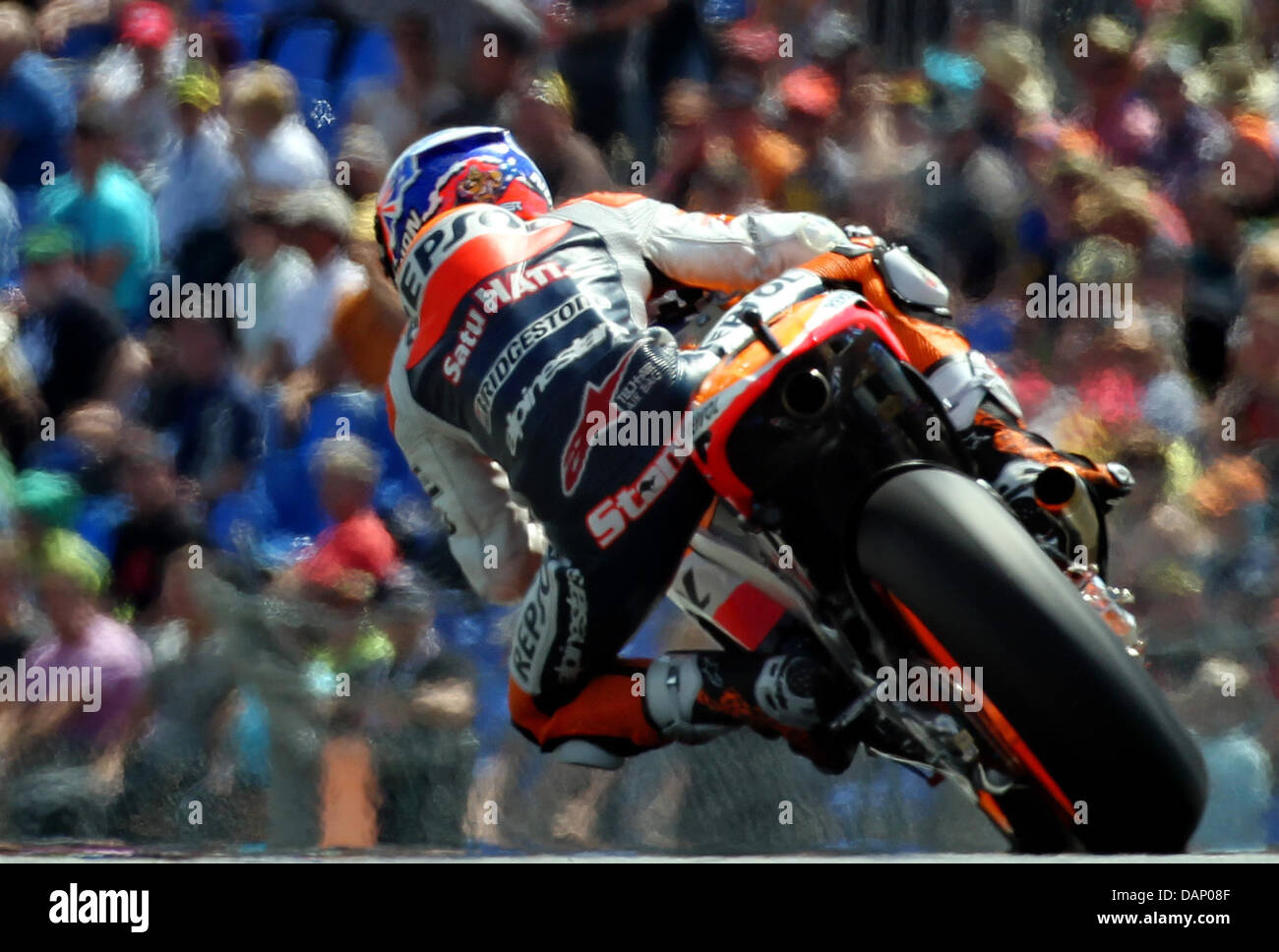 The Australian Honda driver Casey Stoner drives his motorcycle in the ...