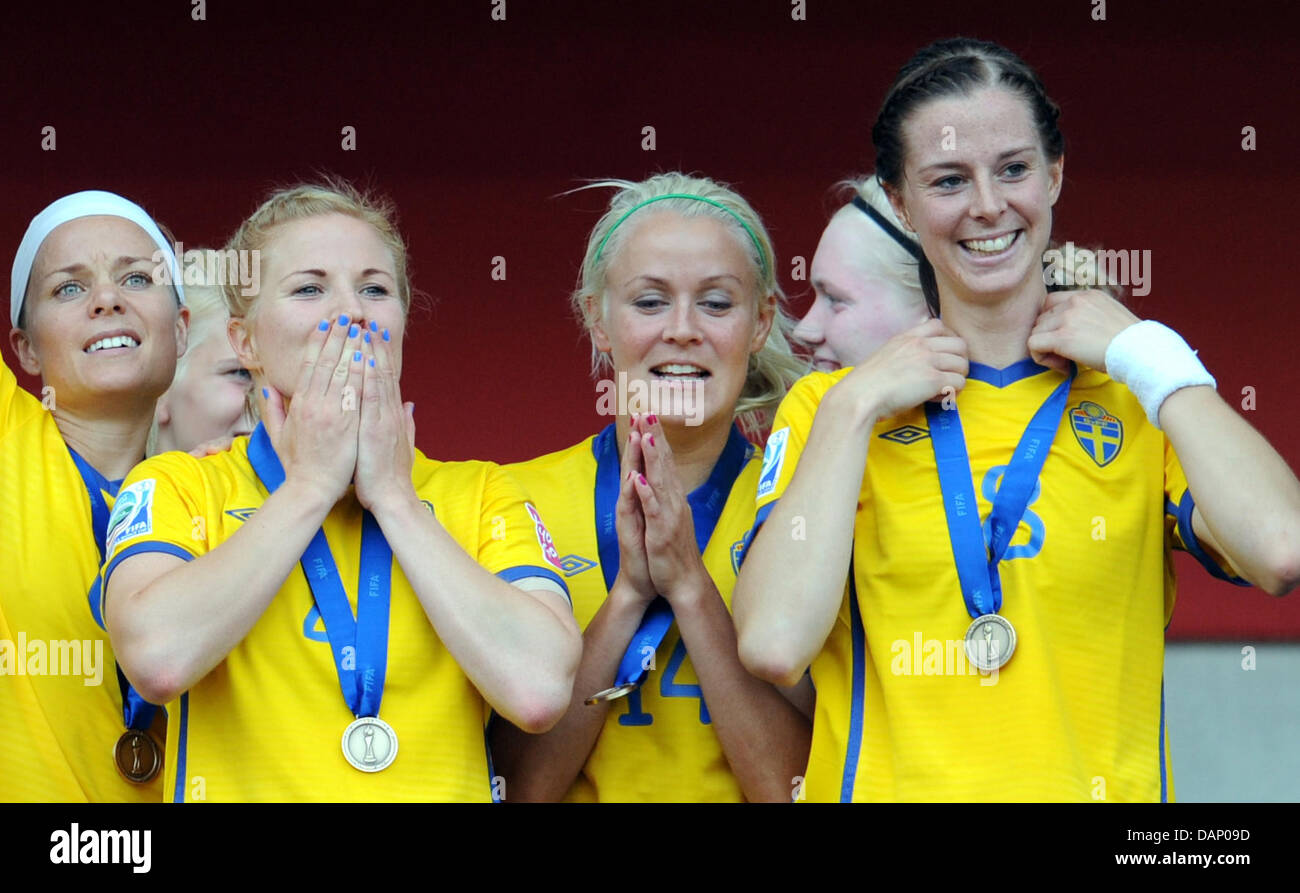 Sweden's team with Lotta Schelin (R) celebrates after winning the FIFA ...