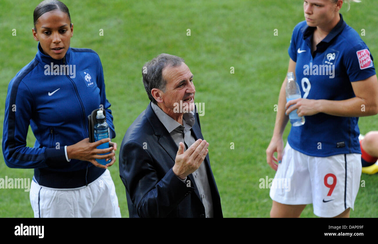 Coach Bruno Bini of France (C) is disappointed after losing the FIFA ...