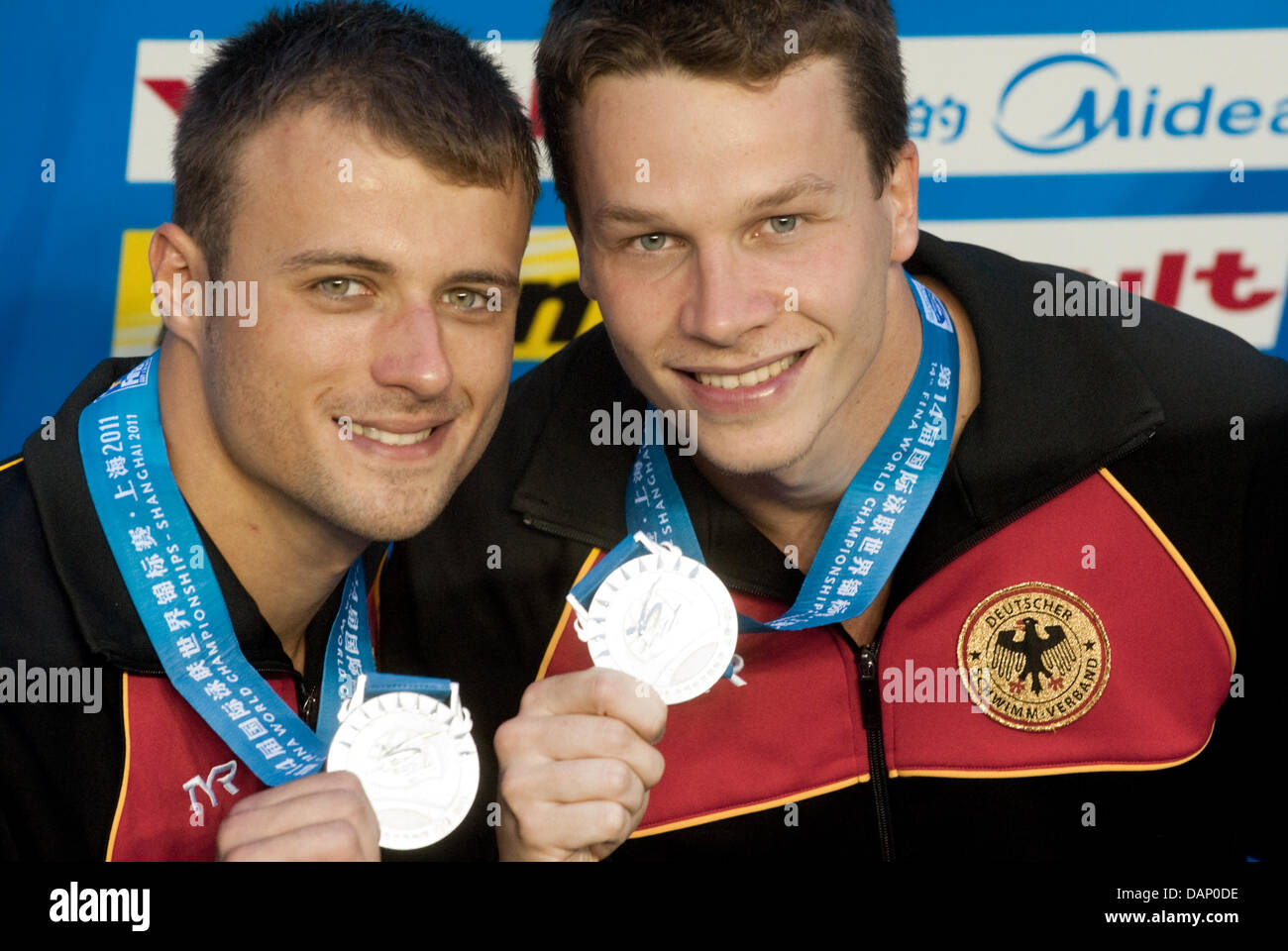 Germany's Sascha Klein (L) and Patrick Hausding display their Silver ...