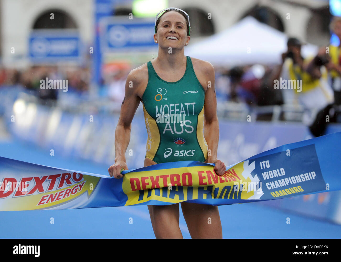 Australian triathlete Emma Moffatt celebrates with the finish line ...