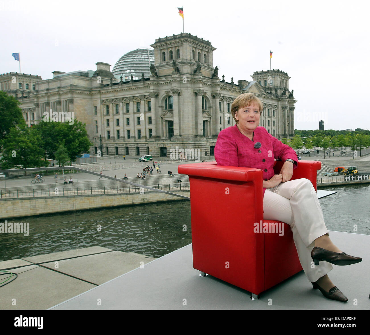 German Chancellor Angela Merkel sits in front of the Reichstag on the ...