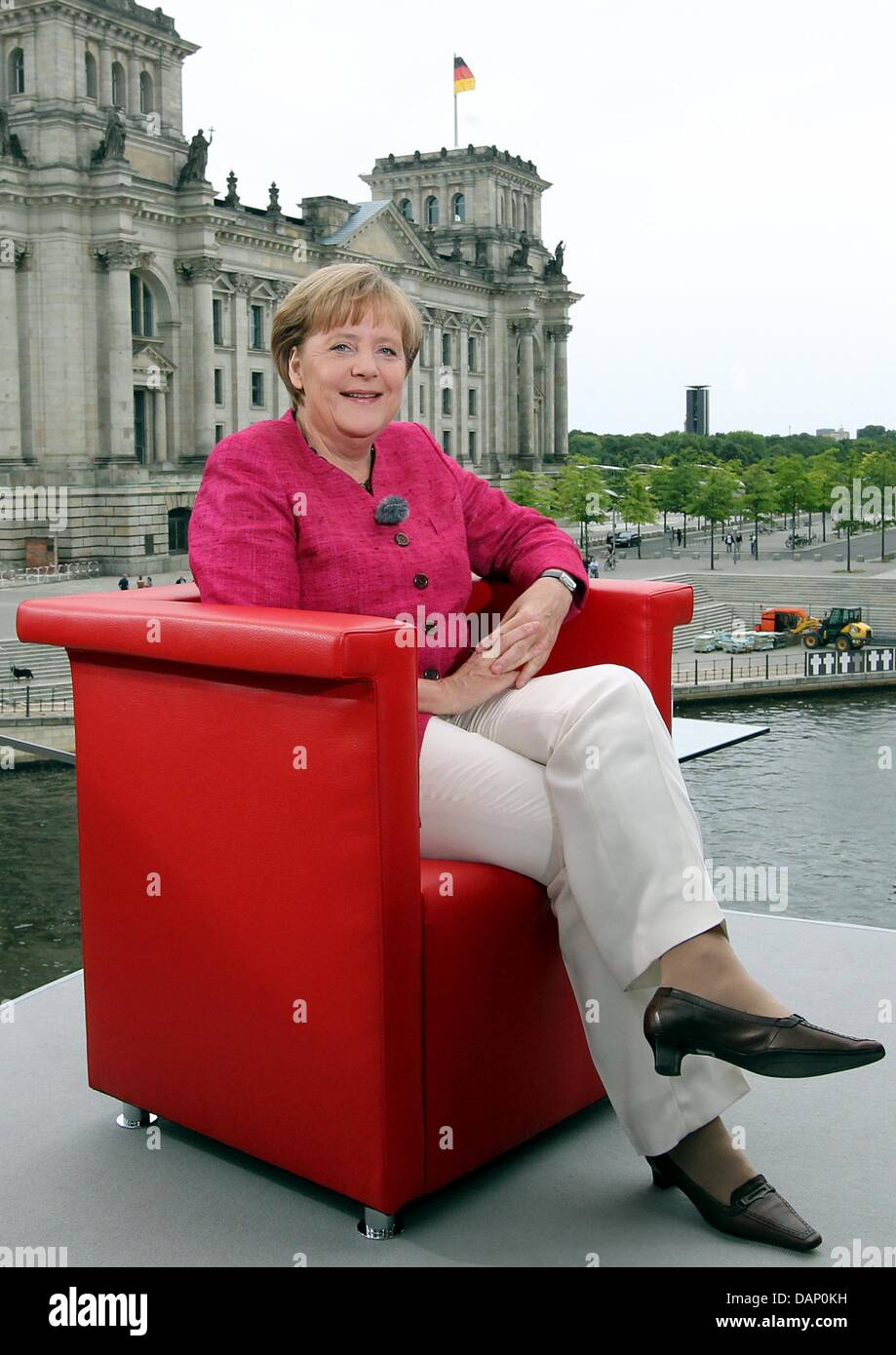 German Chancellor Angela Merkel sits in front of the Reichstag on the ...