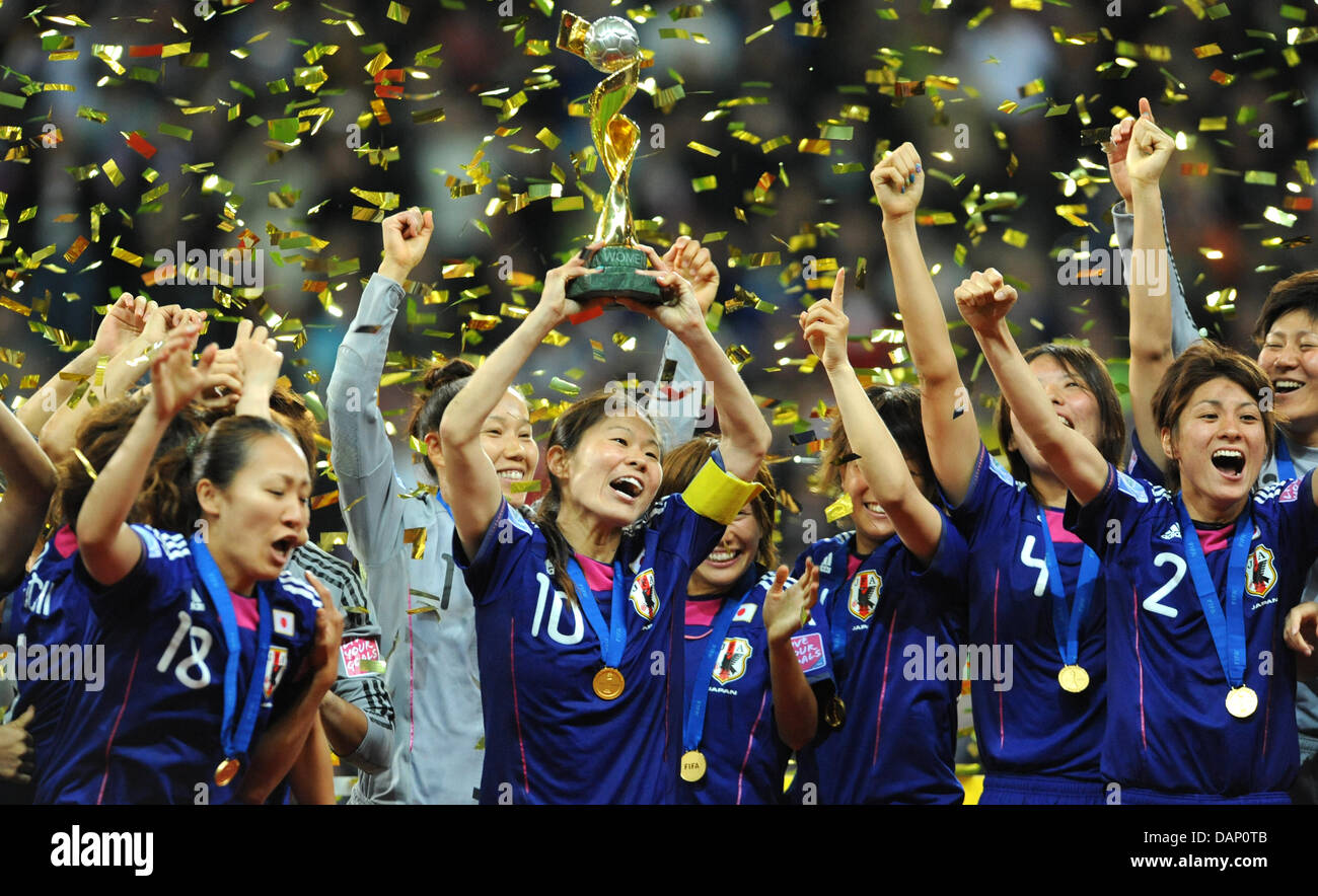 Japan's team around Homare Sawa celebrate with the trophy after the ...