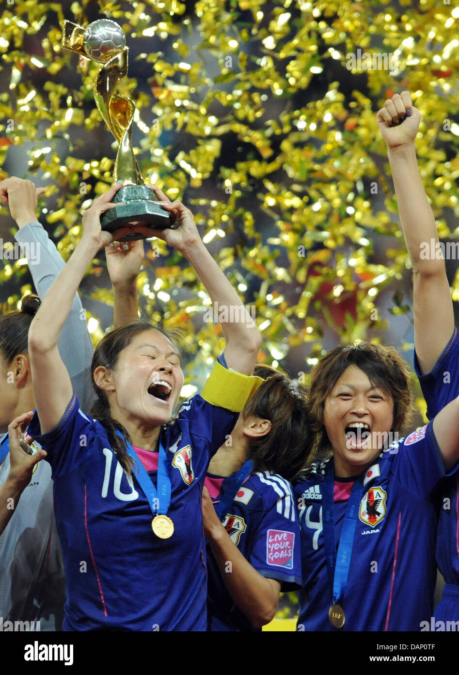 Japan's team around Homare Sawa celebrate with the trophy after the ...