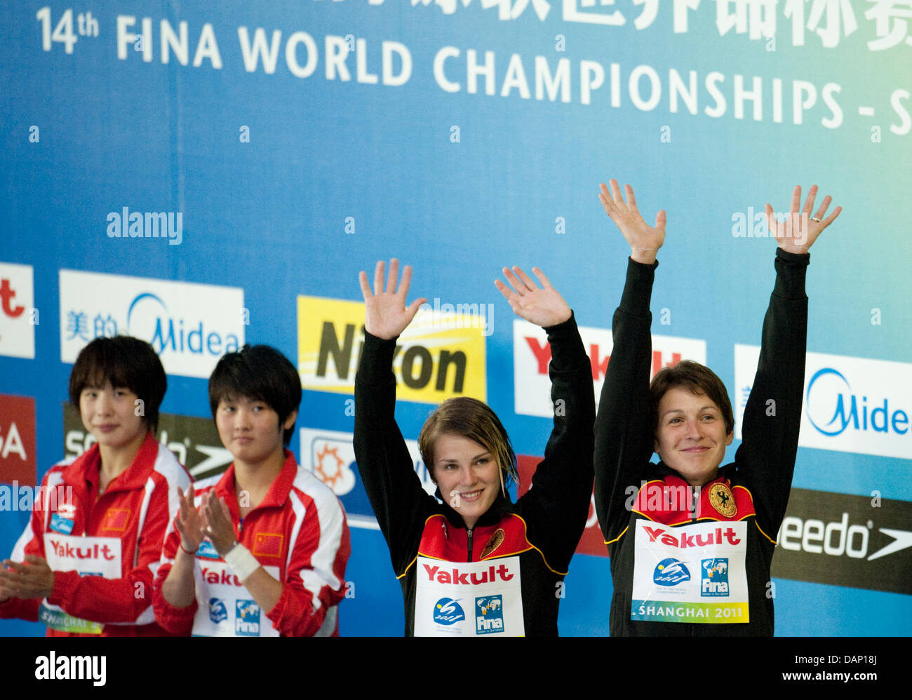 Germany's Nora Subschinski (2-R)and Christin Steuer (R) wave to the ...