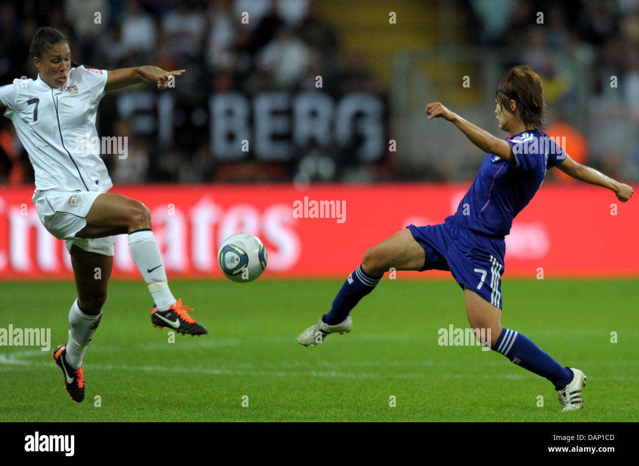 Kozue Ando of Japan and USA's Shannon Boxx (L) vie for the ball during ...
