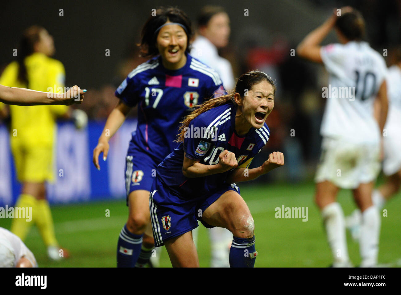 Japanese national soccer player Homare Sawa (front) cheers after ...