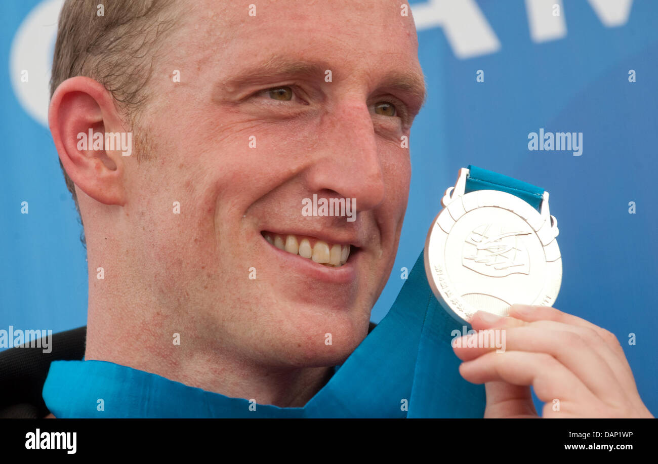 Thomas Lurz from Germany shows his silver medal for placing second in ...