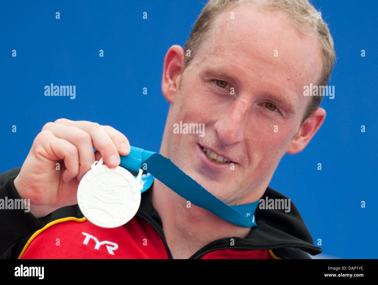 Thomas Lurz from Germany shows his silver medal for placing second in ...