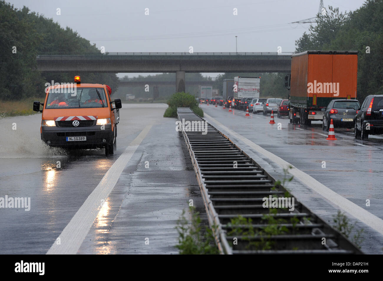 A vehicle of the motorway maintenance drives at Autobahn A73, shut down ...