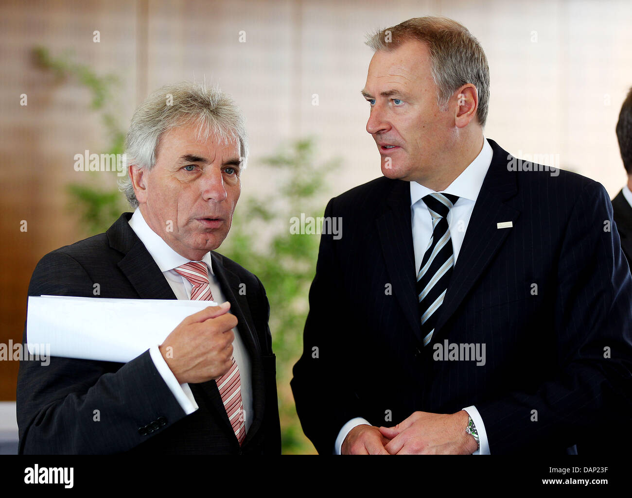 CEO of the Cologne fair association, Gerald Boese (R), talks to ...