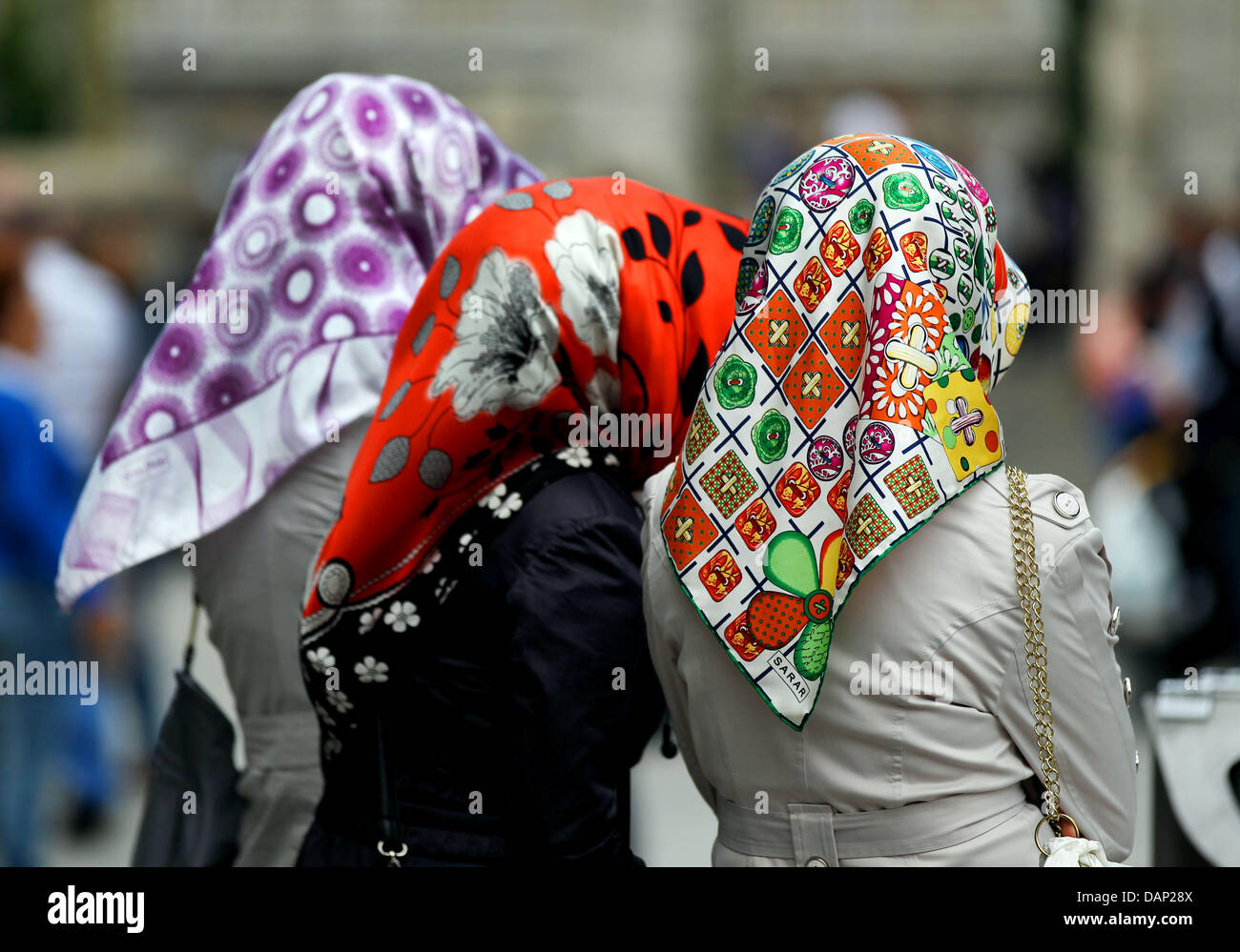 Muslim women stand next to each other at the pedestrian precinct in ...