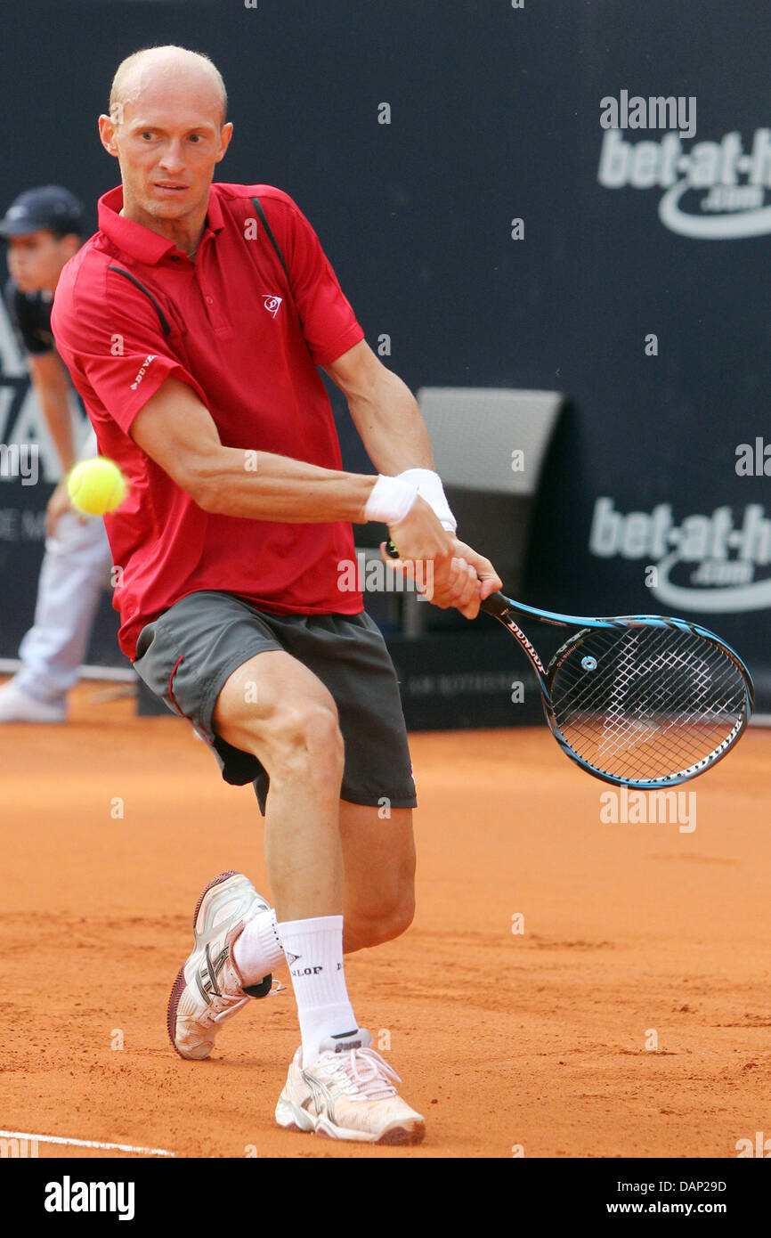 Russian tennis professional Nikolai Davjdenko plays a backhand during ...
