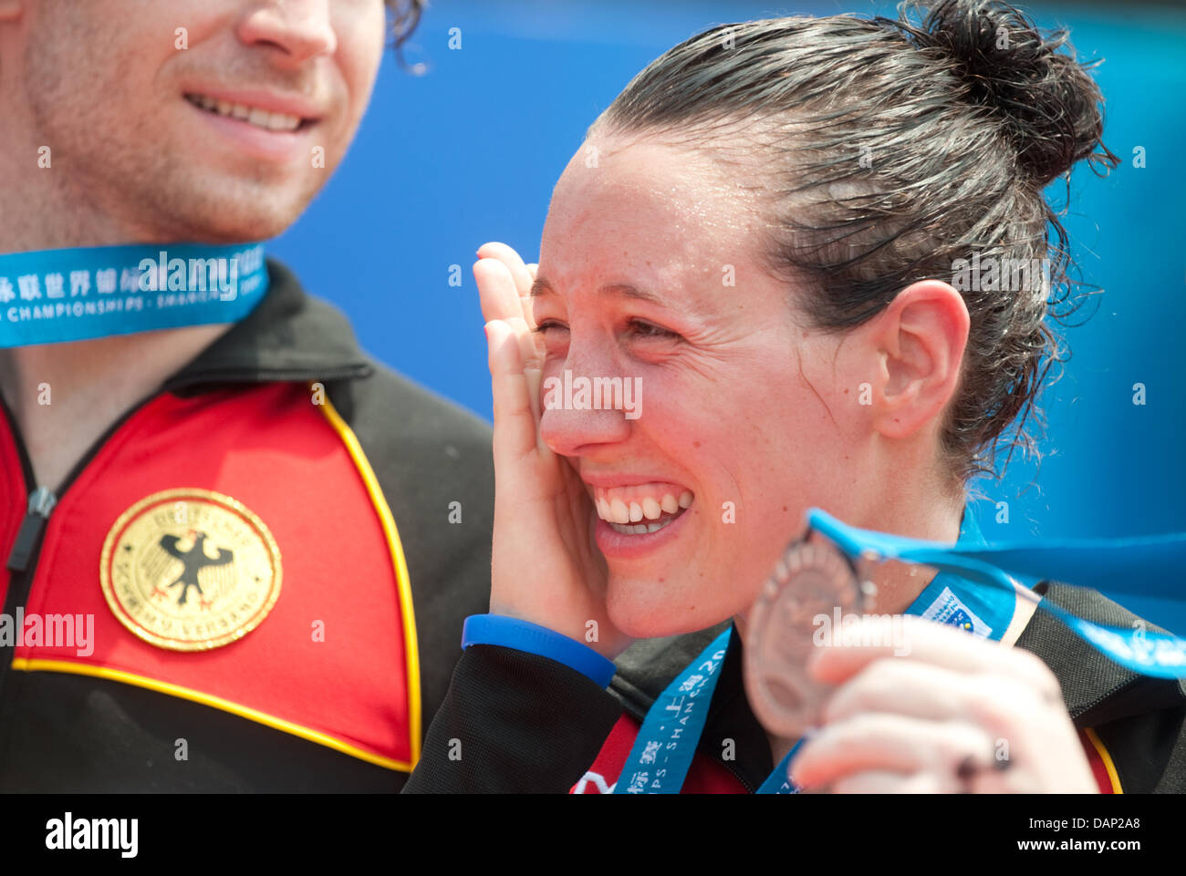Isabell Haerle of Germany wipes tears off her cheek during the medal ...