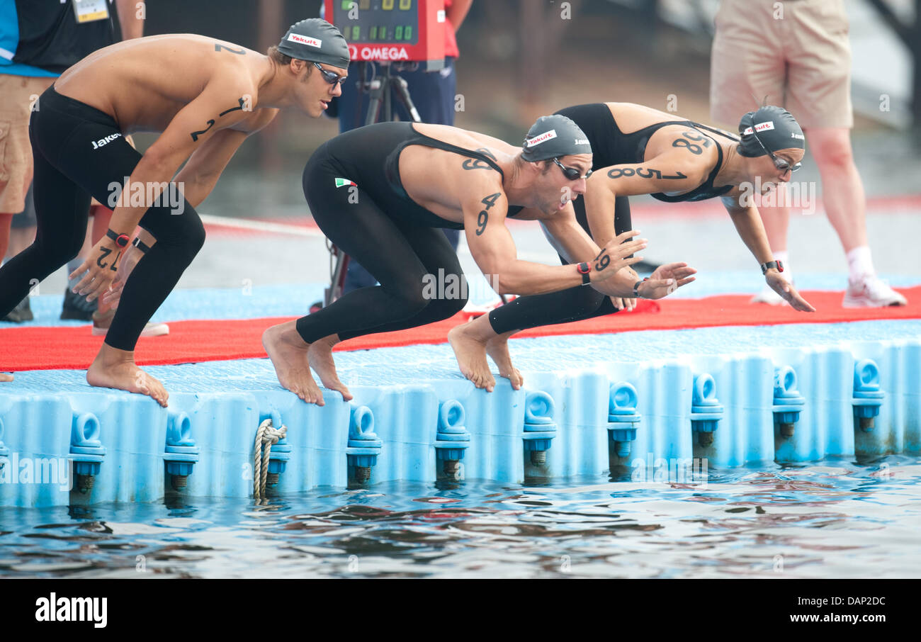 Italy's Nicola Bolzonello, Luca Ferretti and Rachele Bruni (L-R) dive ...