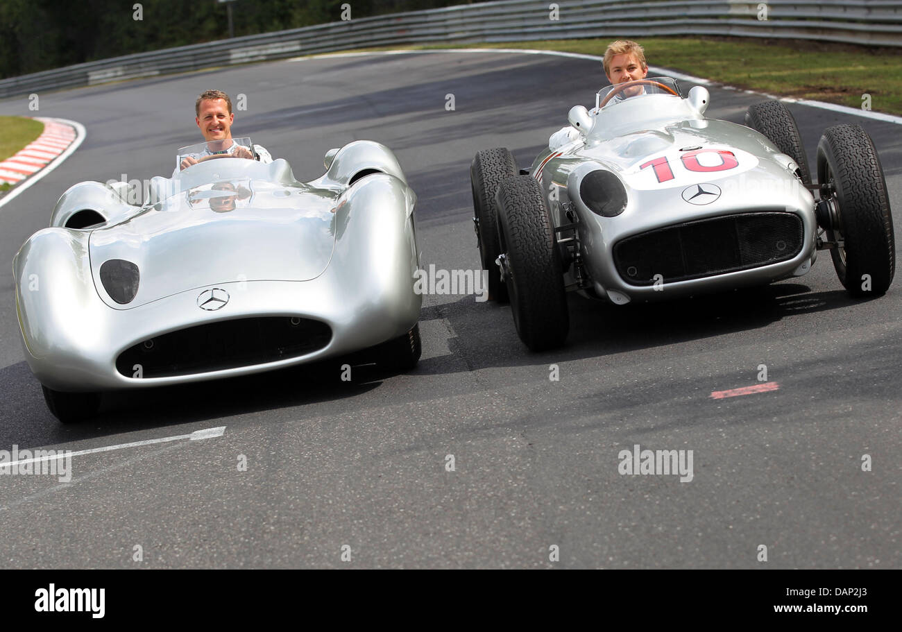 German Formula One driver Nico Rosberg (R) and team-mate Michael ...
