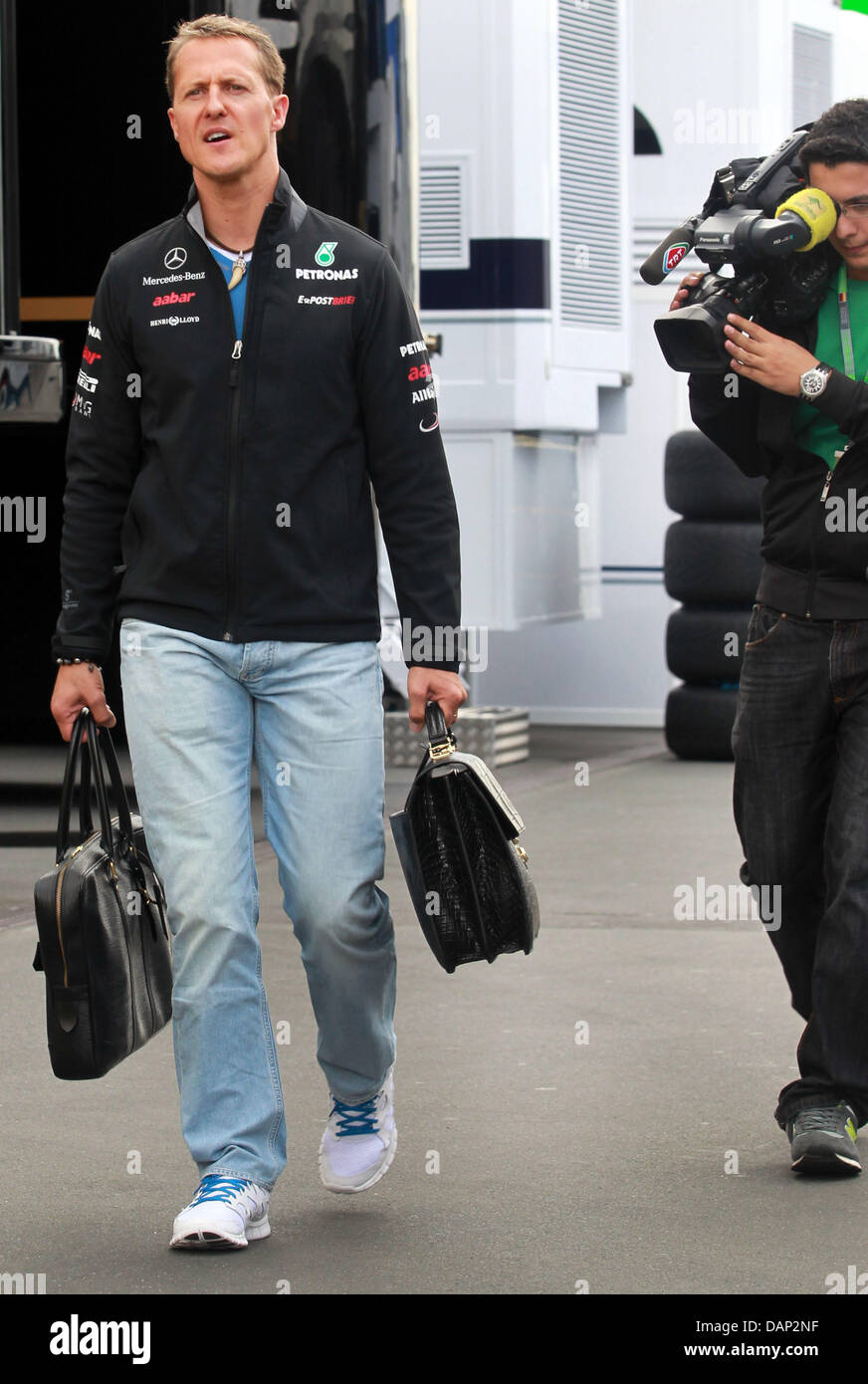German Formula One driver Michael Schumacher of Mercedes GP walks in ...