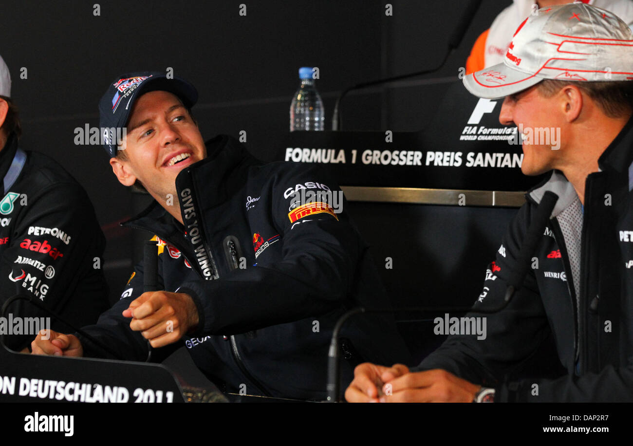 German Formula One driver Sebastian Vettel (L) of Red Bull and German ...