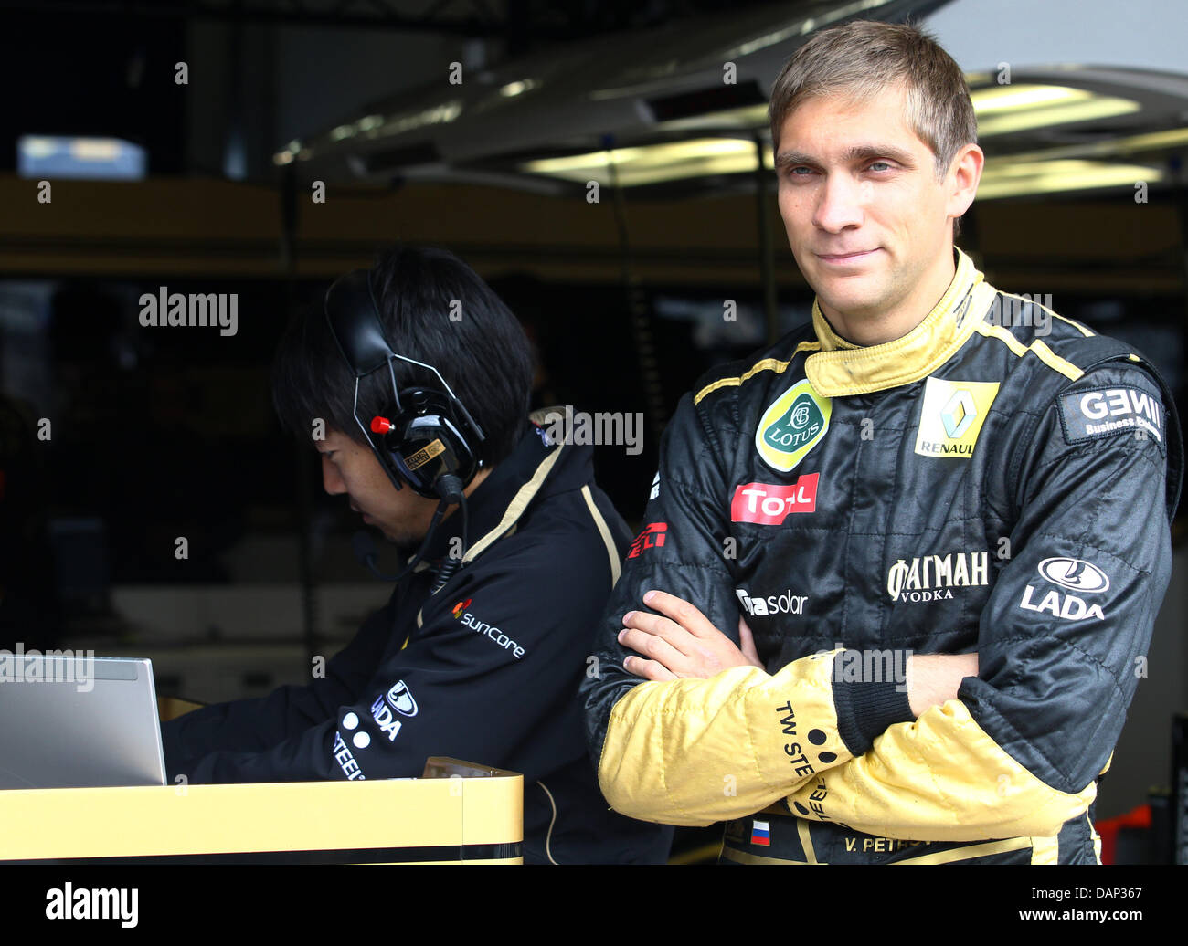 Russian Formula One driver Vitaly Petrov of Lotus Renault prepares for ...