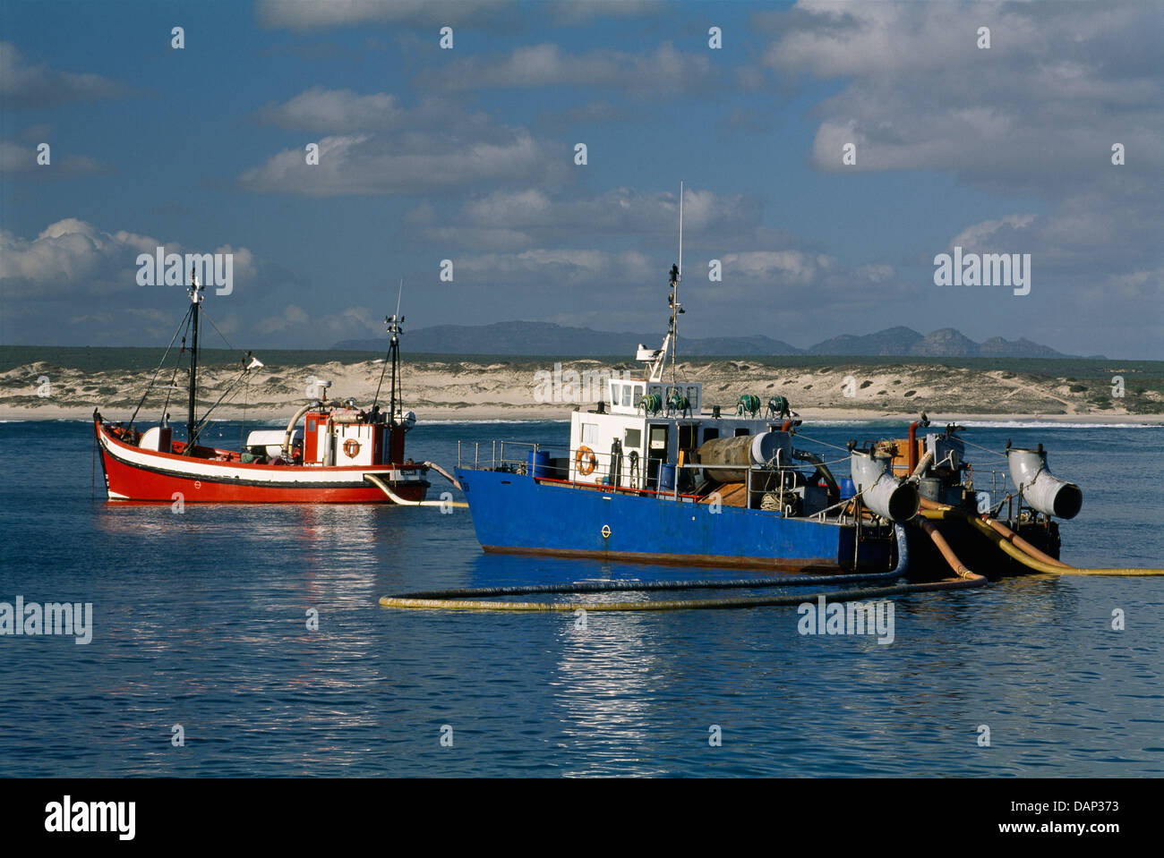 Boats used for diamond mining on the ocean floor in the harbour of Port ...
