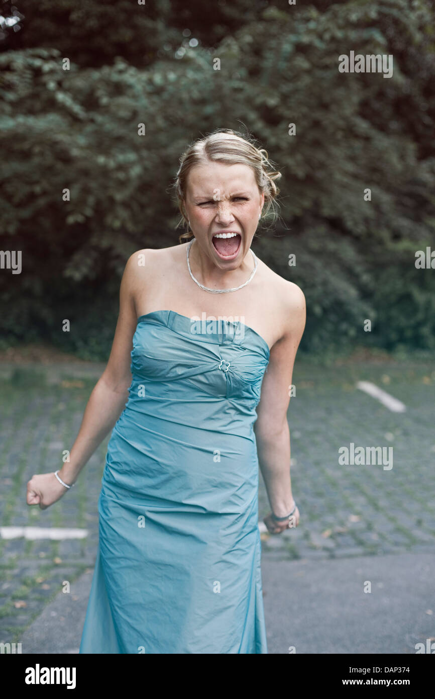 Germany, Duesseldorf, Young woman dressed up and shouting Stock Photo ...