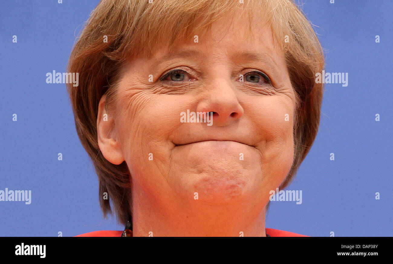 German Chancellor Angela Merkel speaks at the annual summer press ...