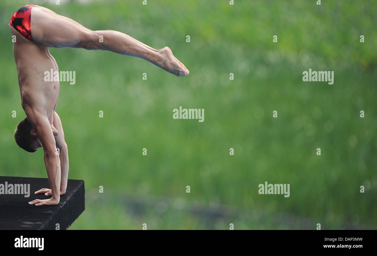 Sascha Klein dives during the men's 10m platform semifinal at the 2011 ...