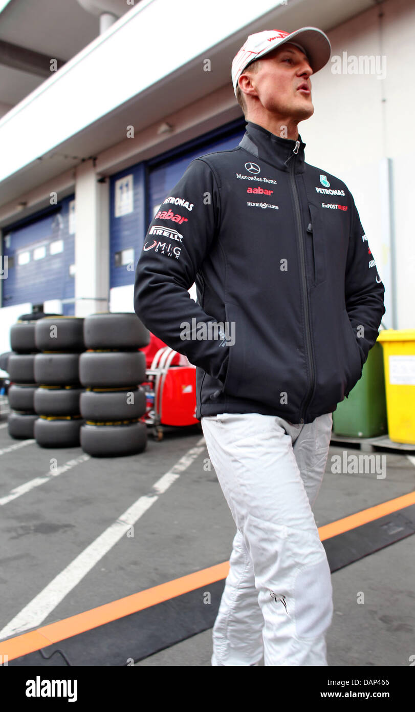German Formula One driver Michael Schumacher of Mercedes GP walks ...