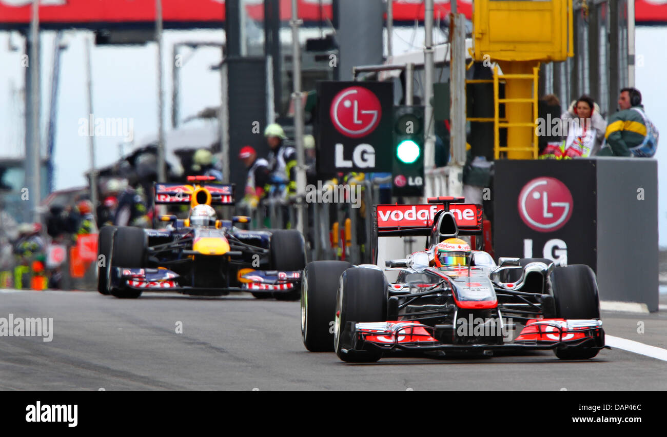 British Formula One driver Lewis Hamilton (R) of McLaren Mercedes ...