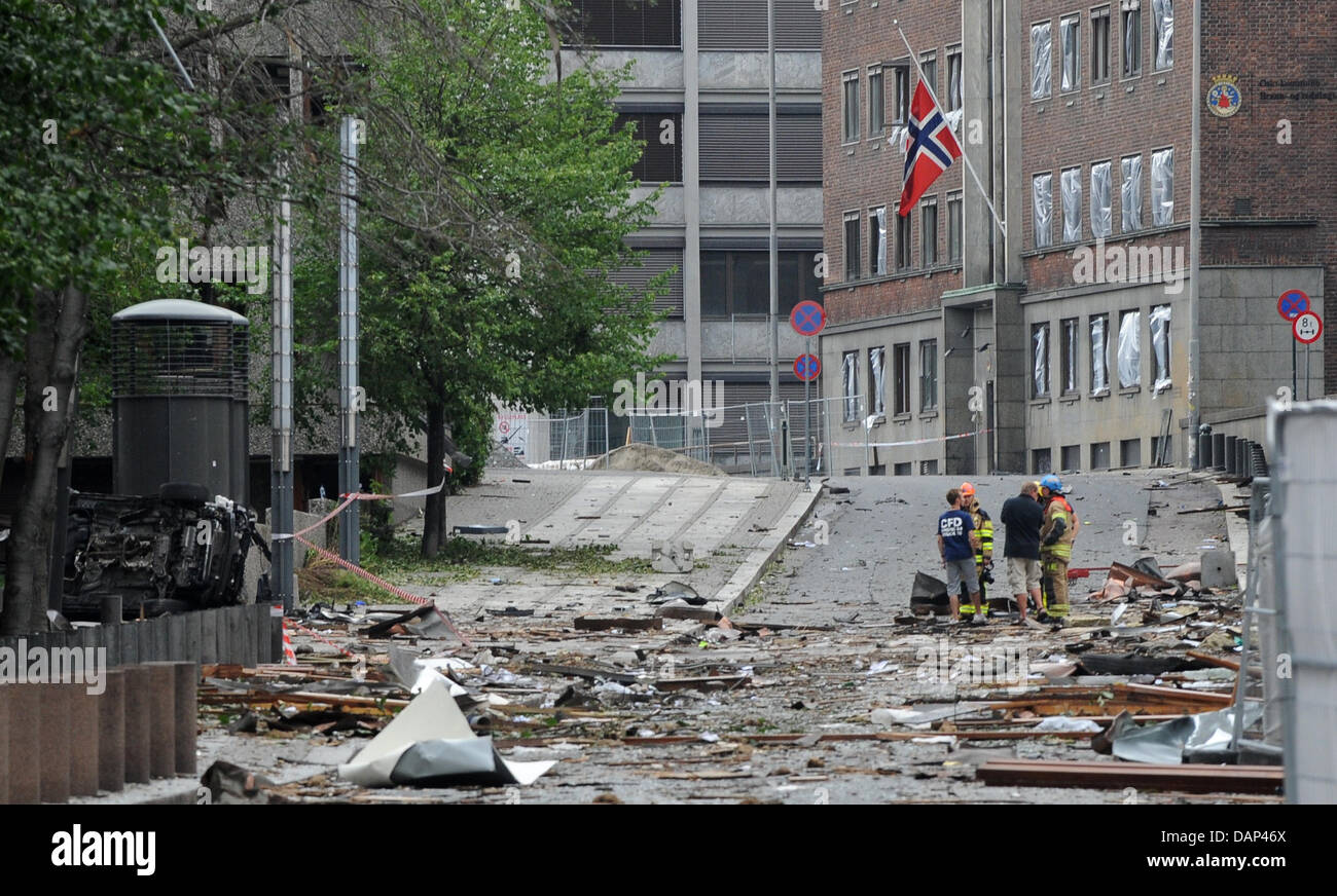 Rescue teams work at the site of the attack in Oslo, Norway, 23 July ...