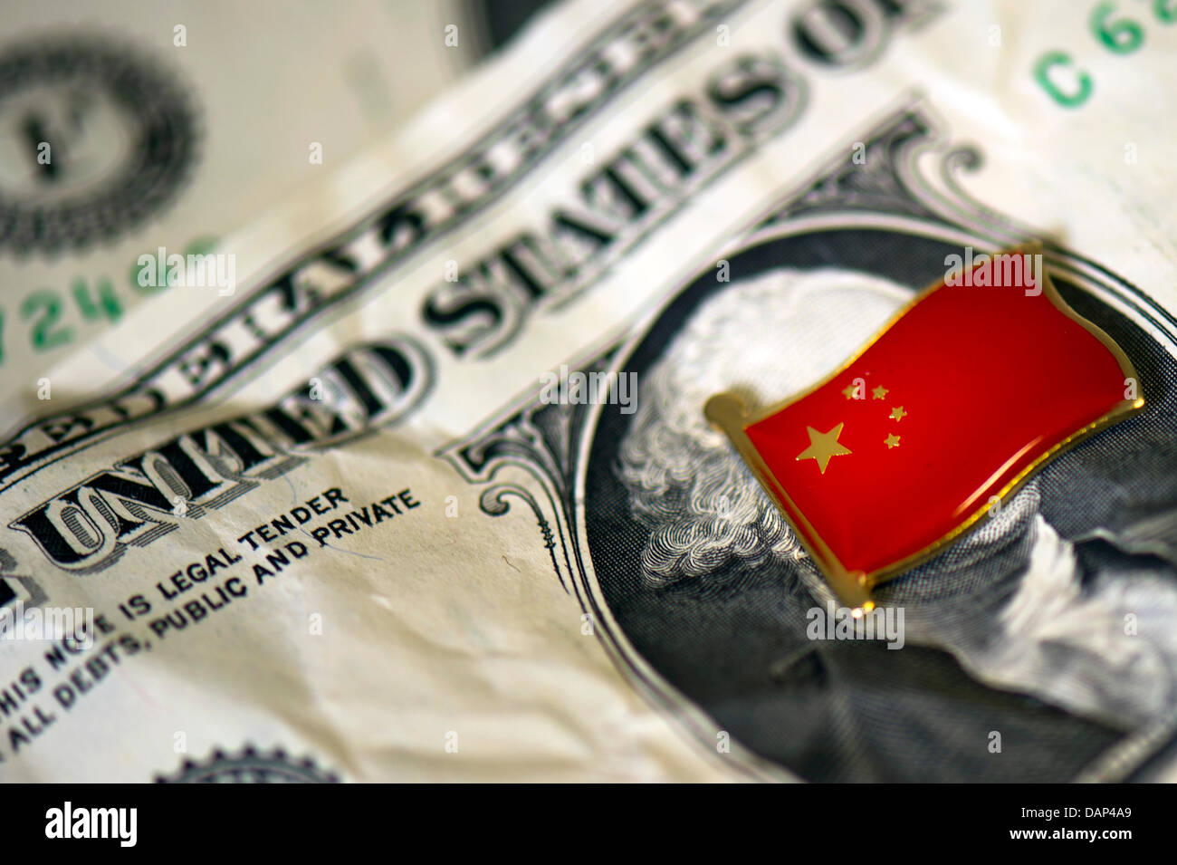 A Chinese flag pin is sticked to a One dollar banknote in Dresden ...