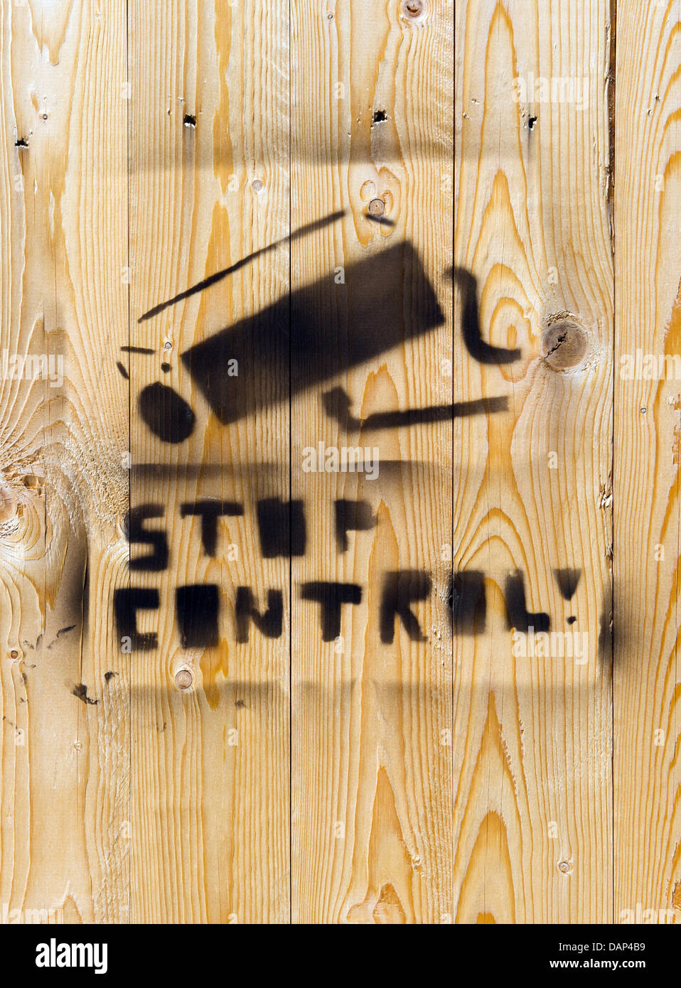 A graffiti, showing a surveillance camera and the lettering 'Stop ...