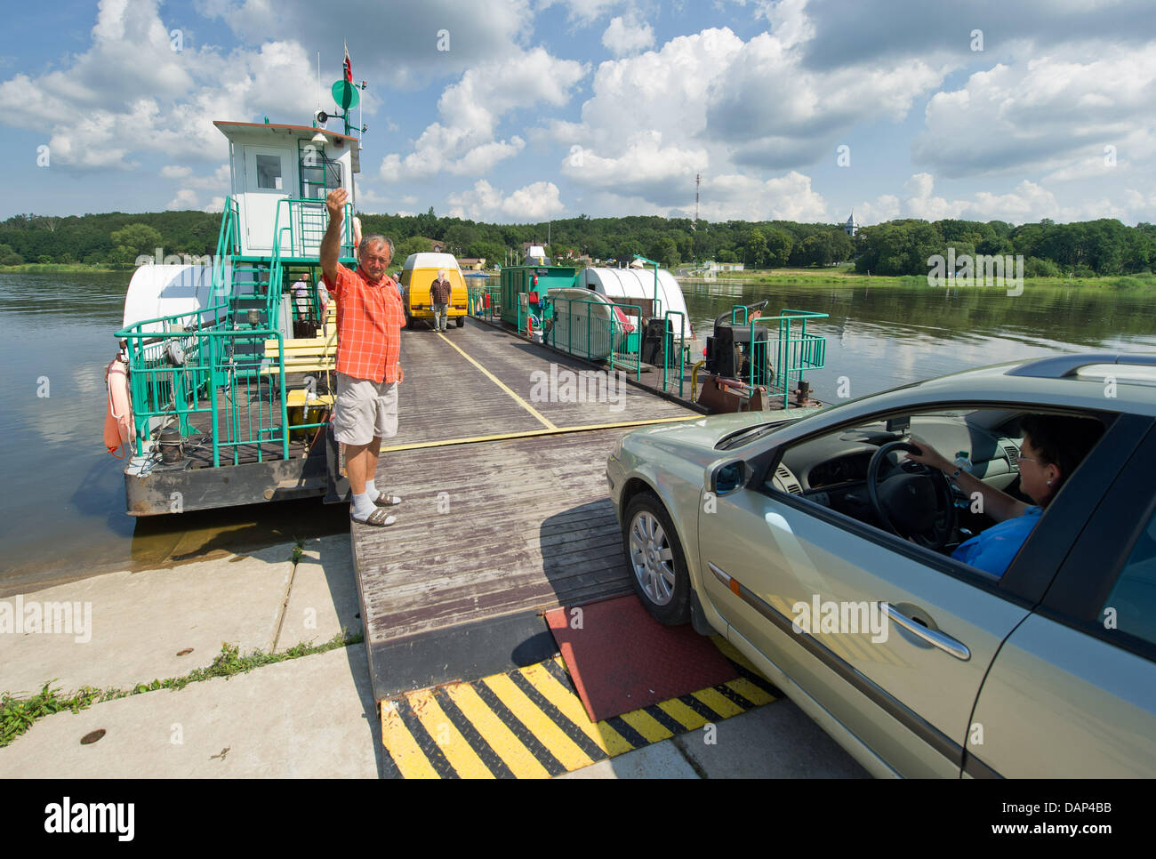 Ferry driver Jerzy Fitas (L) stands on his paddle steamer ferry 'Bez ...