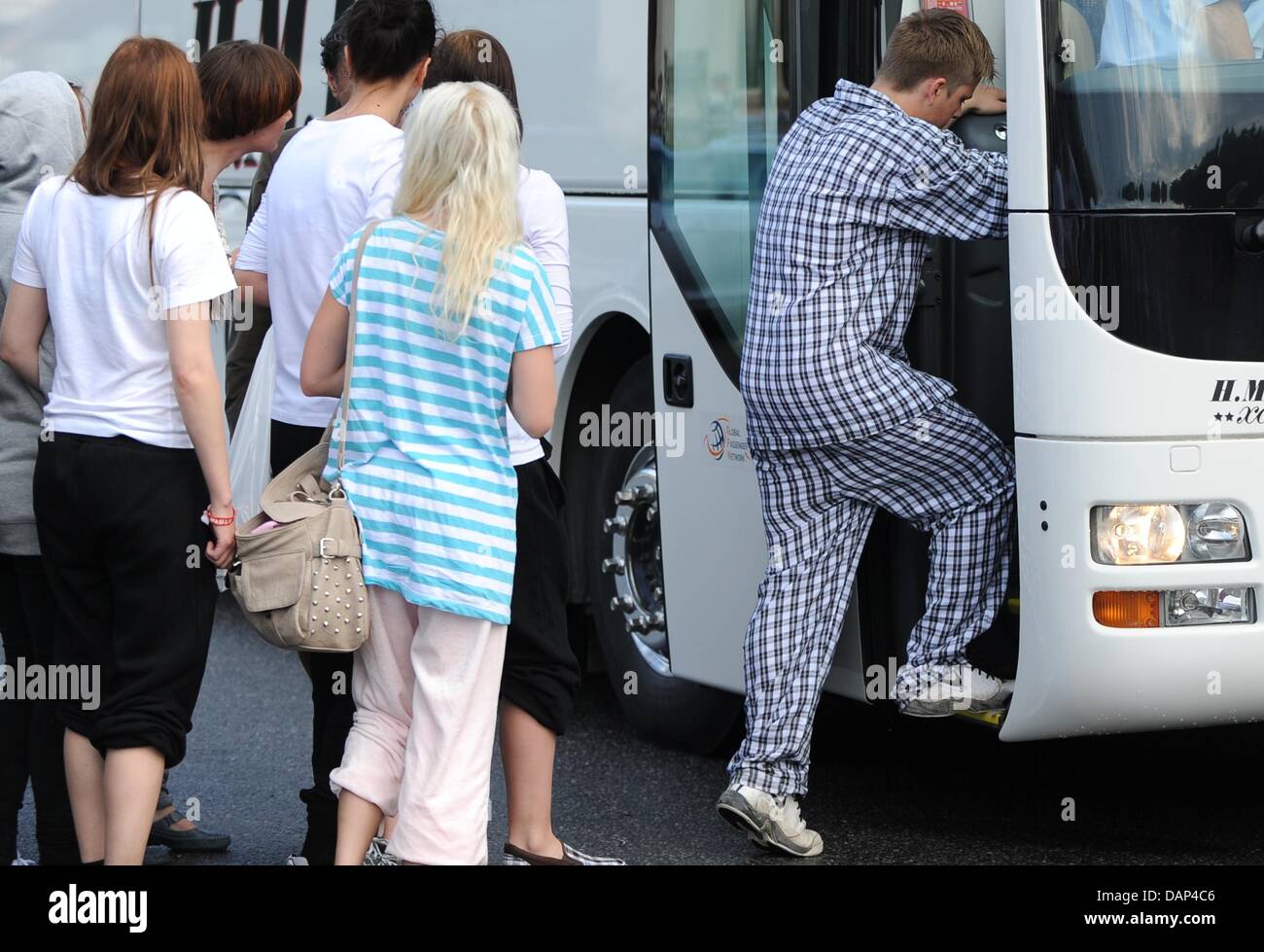 Survivors of the massacre on Utoya island enter a bus in Sundvollen ...
