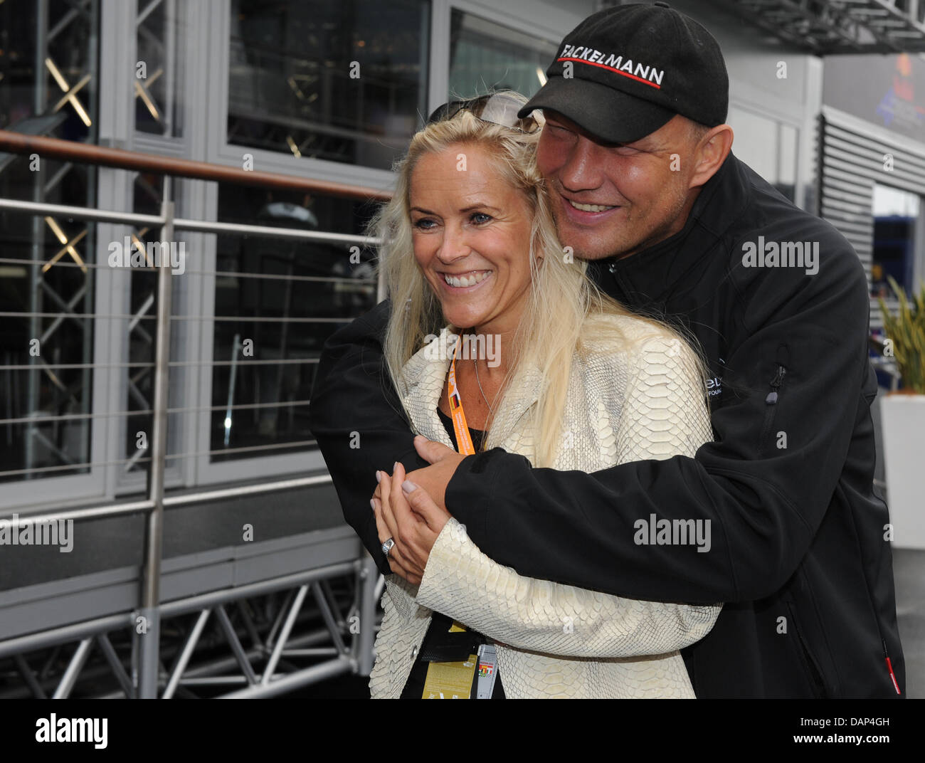 Former boxer Axel Schulz and his wife Patricia seen in the paddock ...