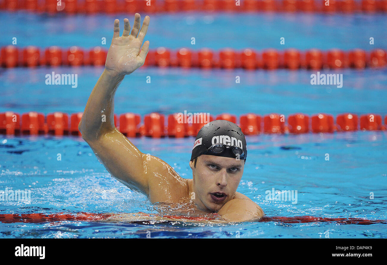 Swimmer Alexander Dale Oen of Norway reacts after his men's 100m ...