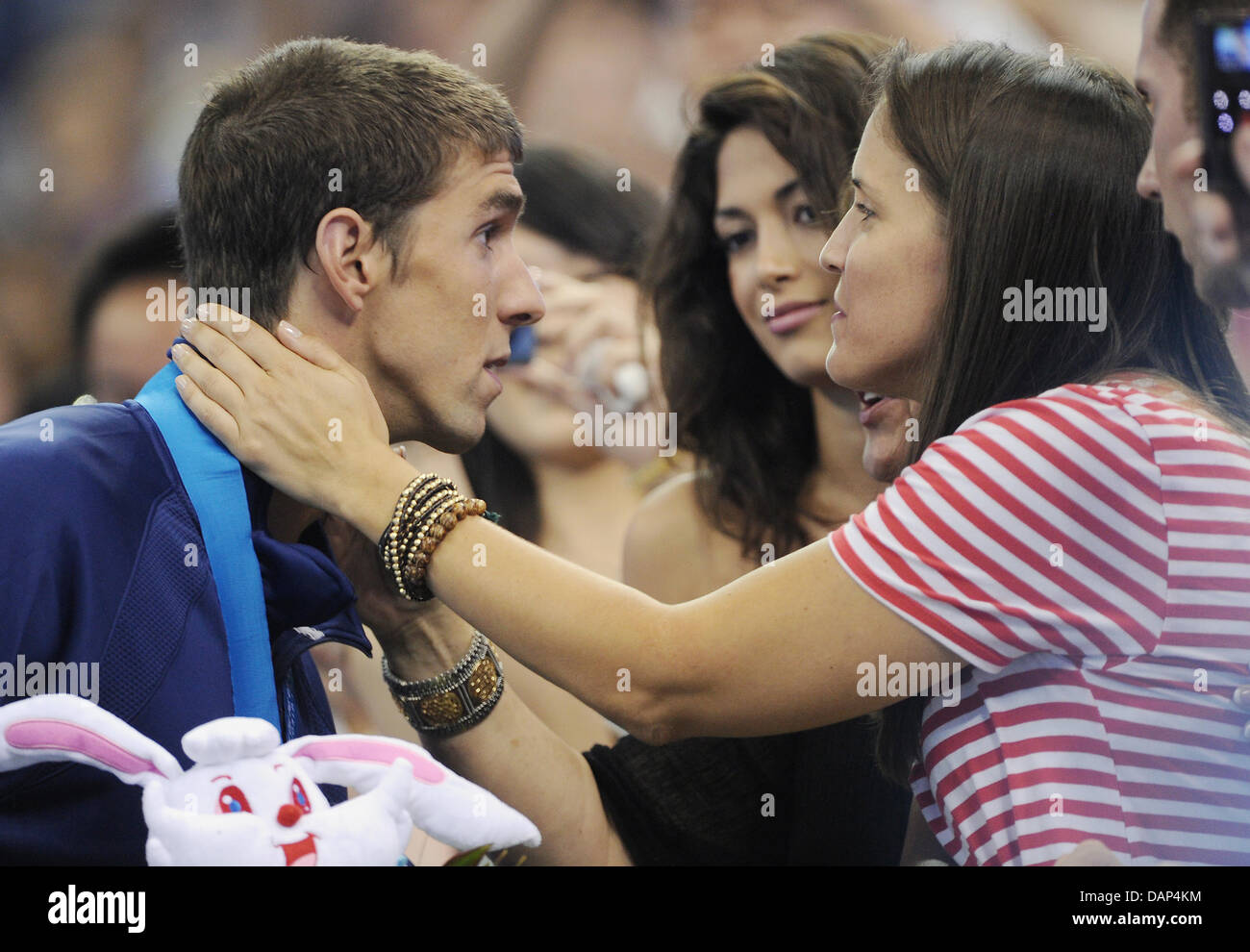 Swimmer Michael Phelps (L) of USA talks with his sister Hilary (R) and ...