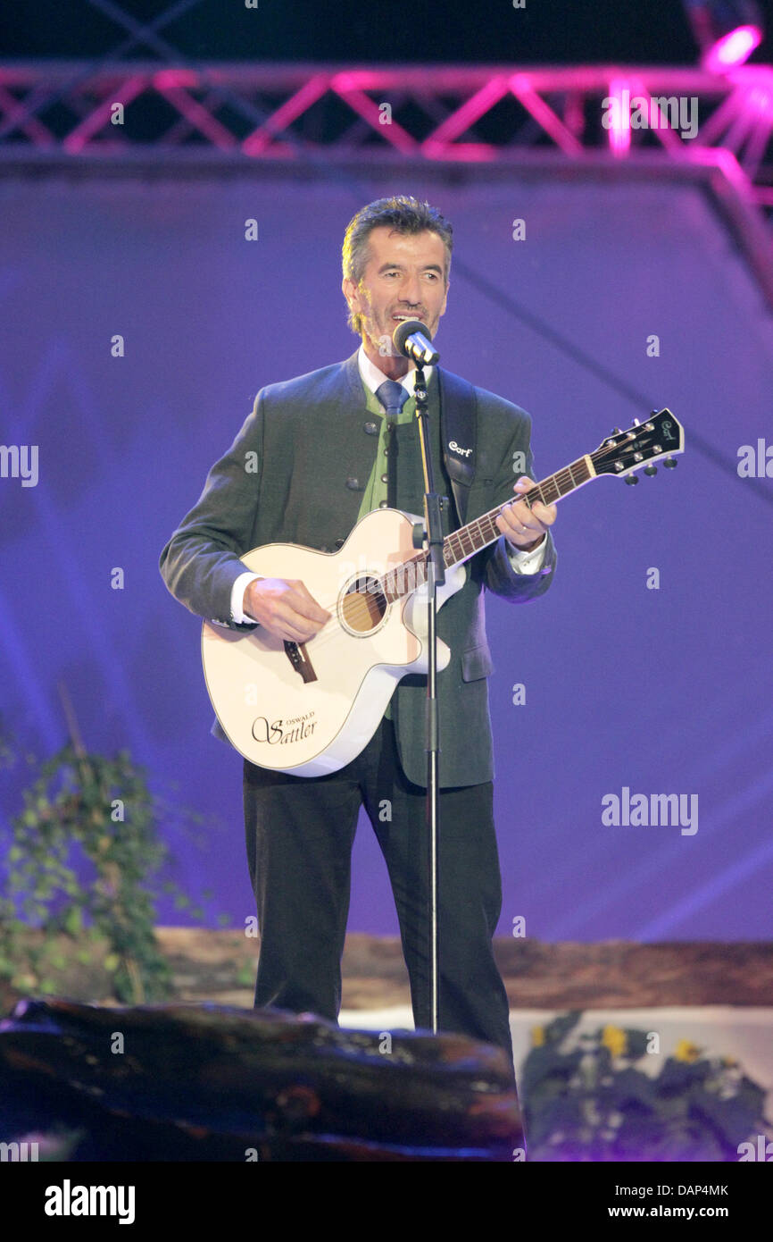 The South Tyrolean singer Oswald Sattler performs during the final ...