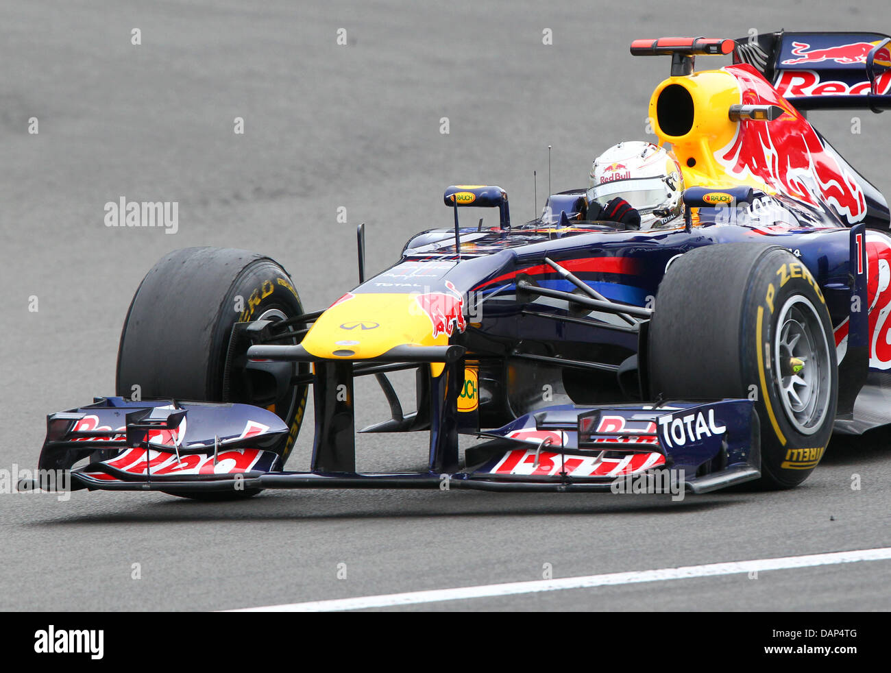German Formula One driver Sebastian Vettel of Red Bull steers his car ...