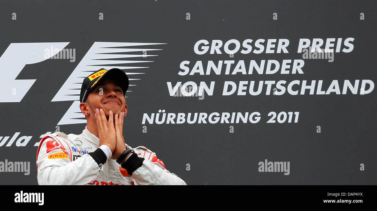McLaren Mercedes' British driver Lewis Hamilton celebrates winning on ...
