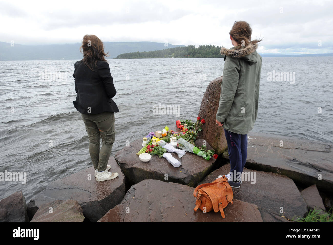 Girl react at a makeshift memorial for the victims of the massacre on ...